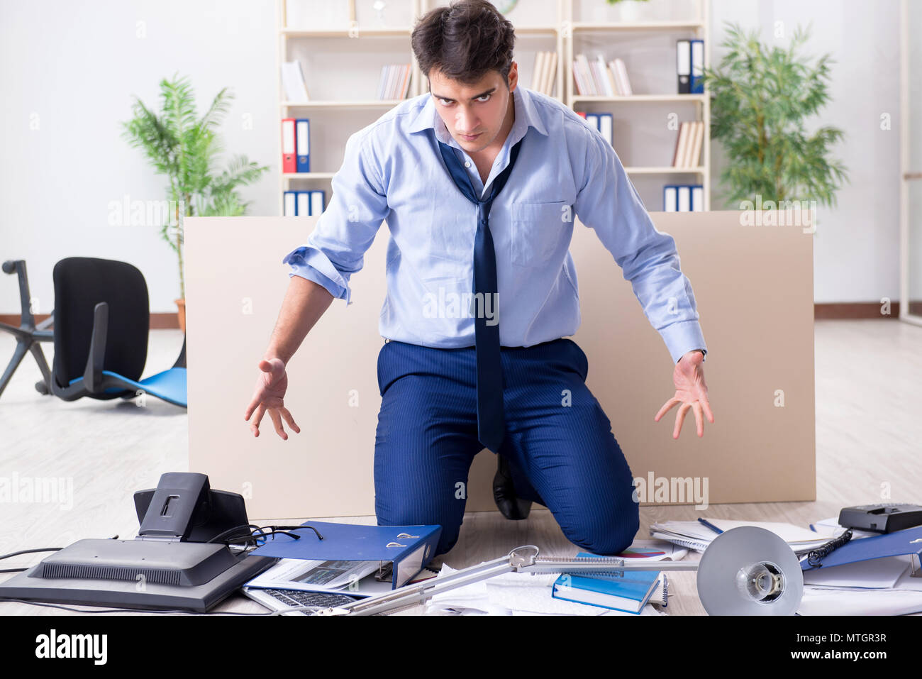 Angry businessman frustrated with too much work Stock Photo - Alamy