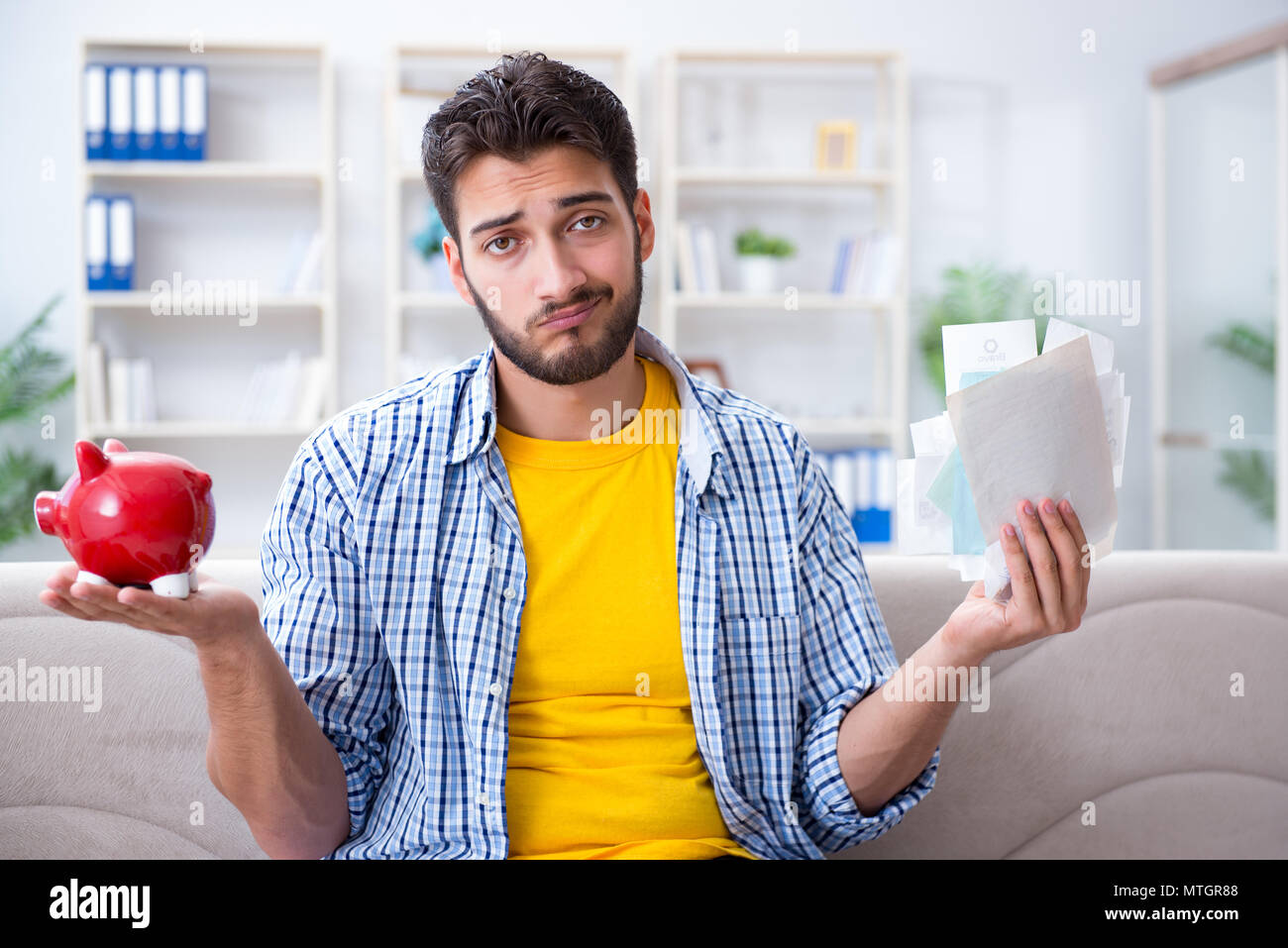 Man angry at bills he needs to pay Stock Photo - Alamy