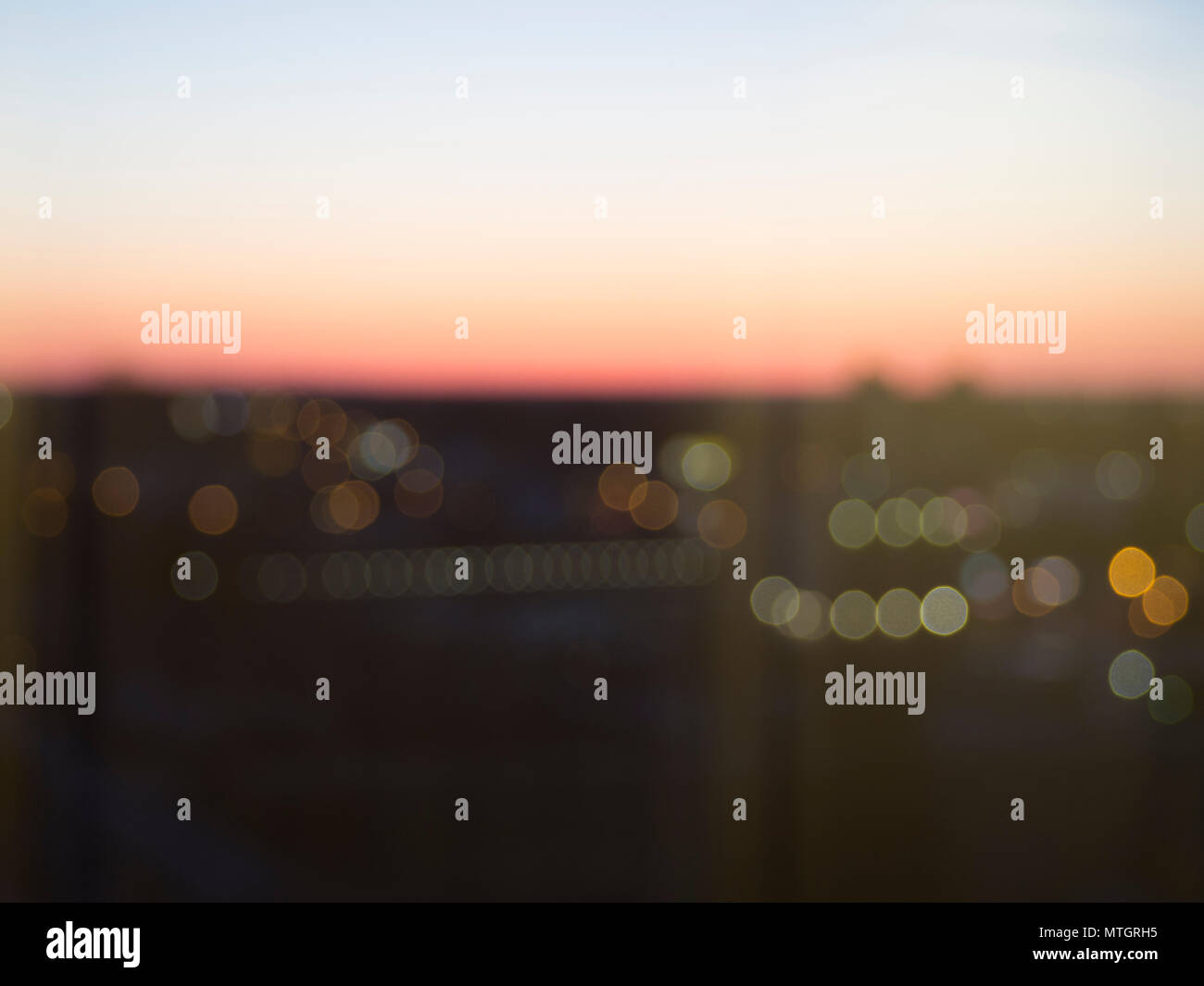 Beautiful Bokeh background showing city lights and sunset in the ...