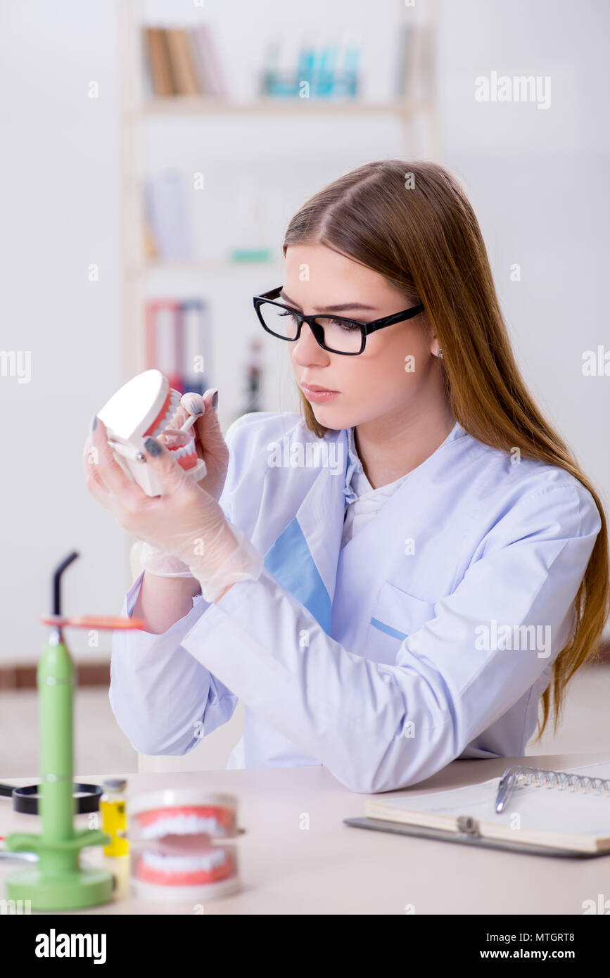 Dentistry student practicing skills in classroom Stock Photo - Alamy