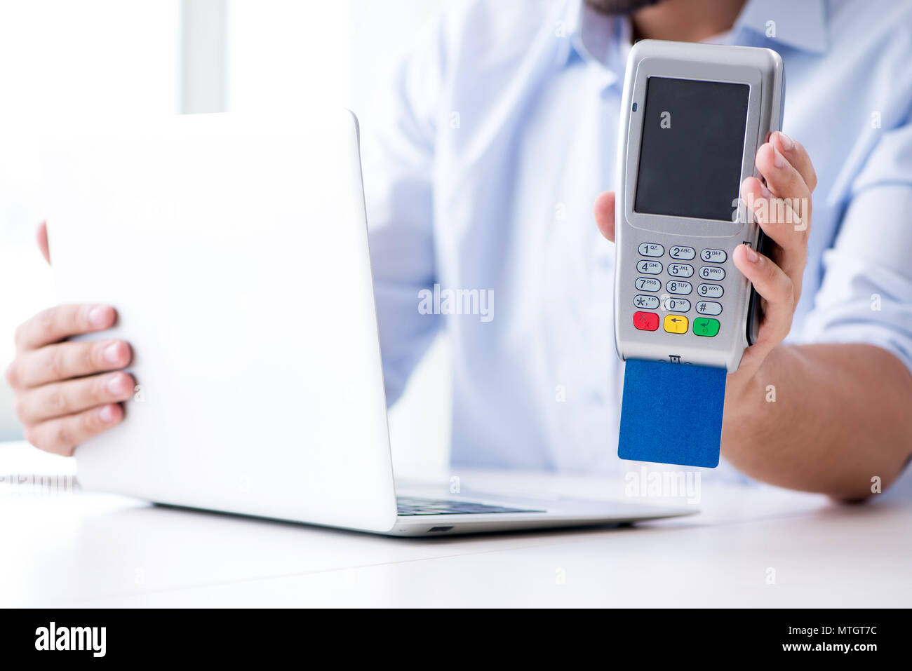 Man processing credit card transaction with POS terminal Stock Photo ...