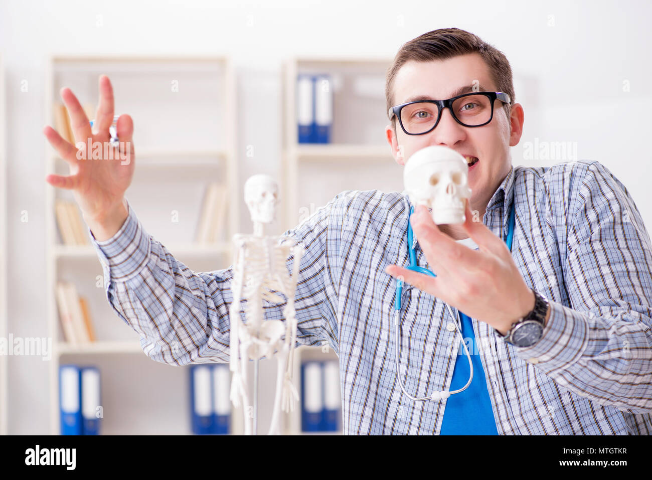 Medical student studying skeleton in classroom during lecture Stock ...
