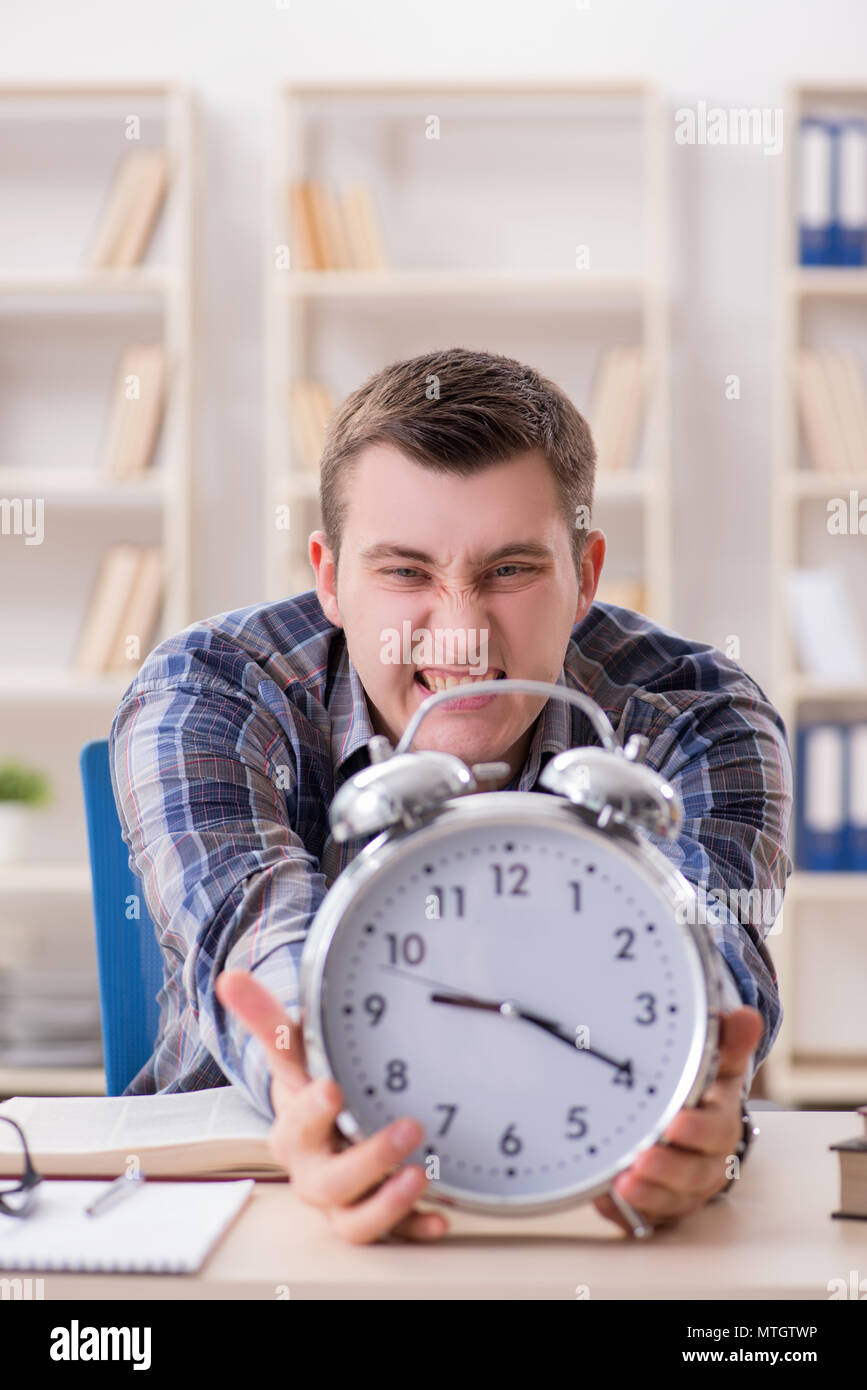 Student getting late with exam preparation Stock Photo - Alamy