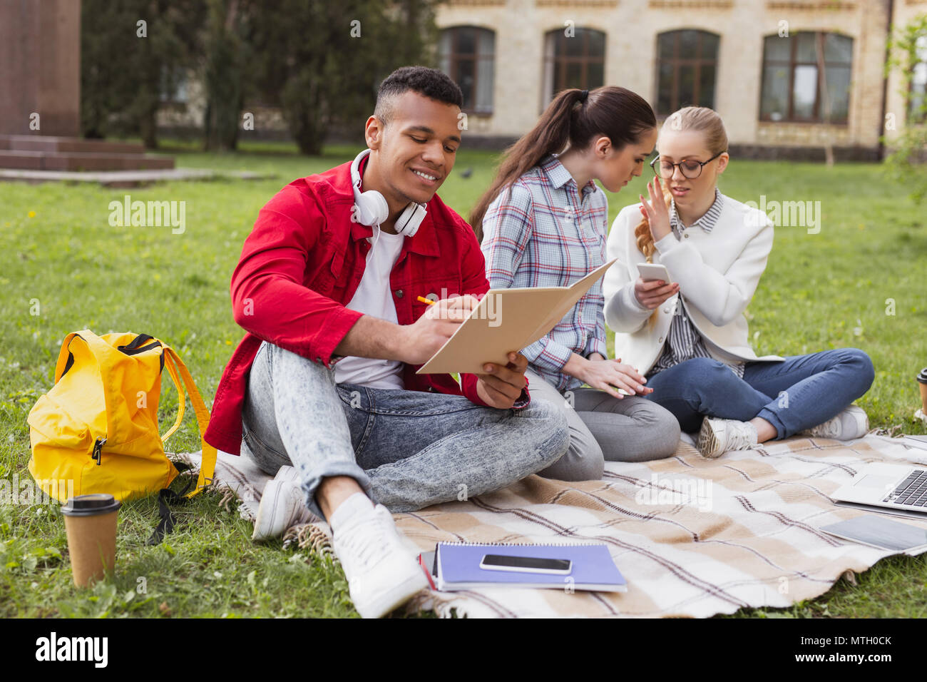 Three students preparing for important contest Stock Photo - Alamy