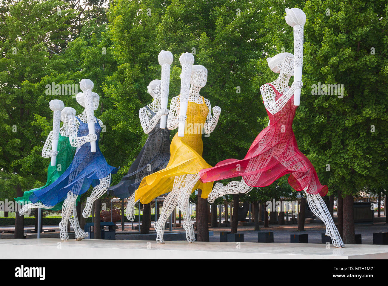 A sculpture of running women with Olympic torches Stock Photo - Alamy