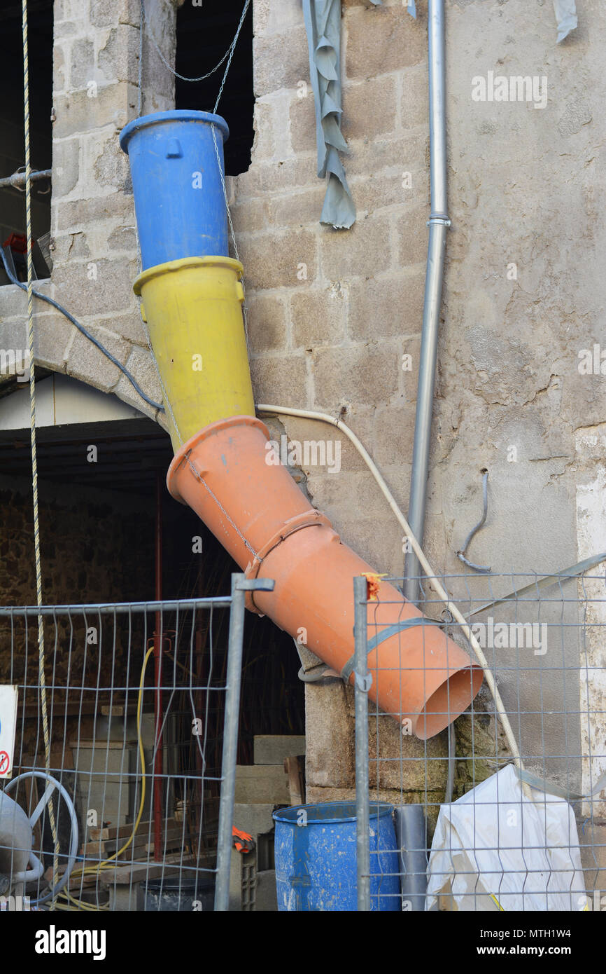 A device for the safe disposal of construction debris from a building ...