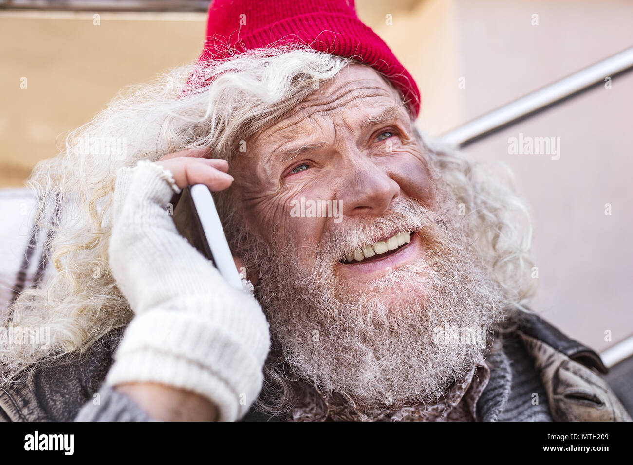 Portrait of a cheerful homeless man Stock Photo - Alamy