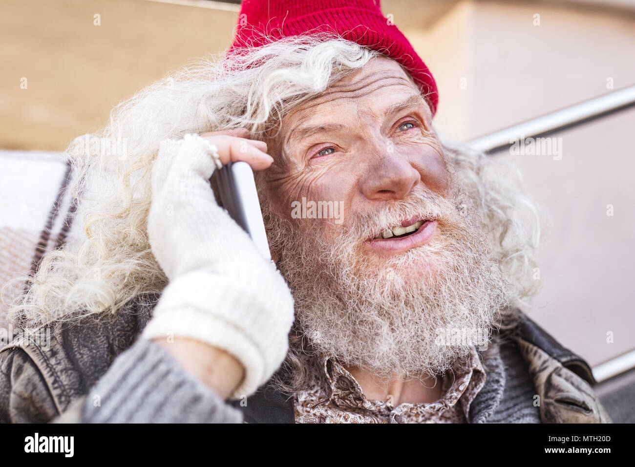 Delighted joyful man enjoying his conversation Stock Photo - Alamy