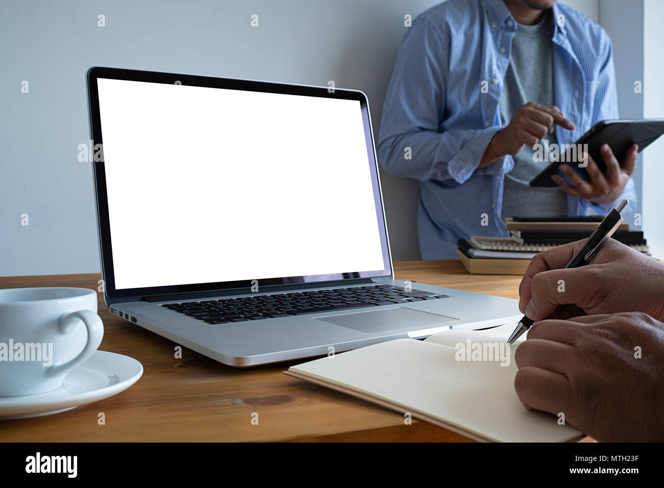 man work hard Laptop with blank screen on table. Workspace background ...