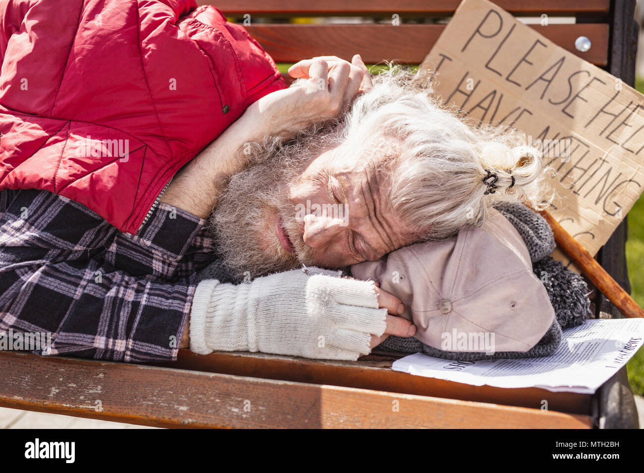Nice homeless man having nowhere to live Stock Photo - Alamy