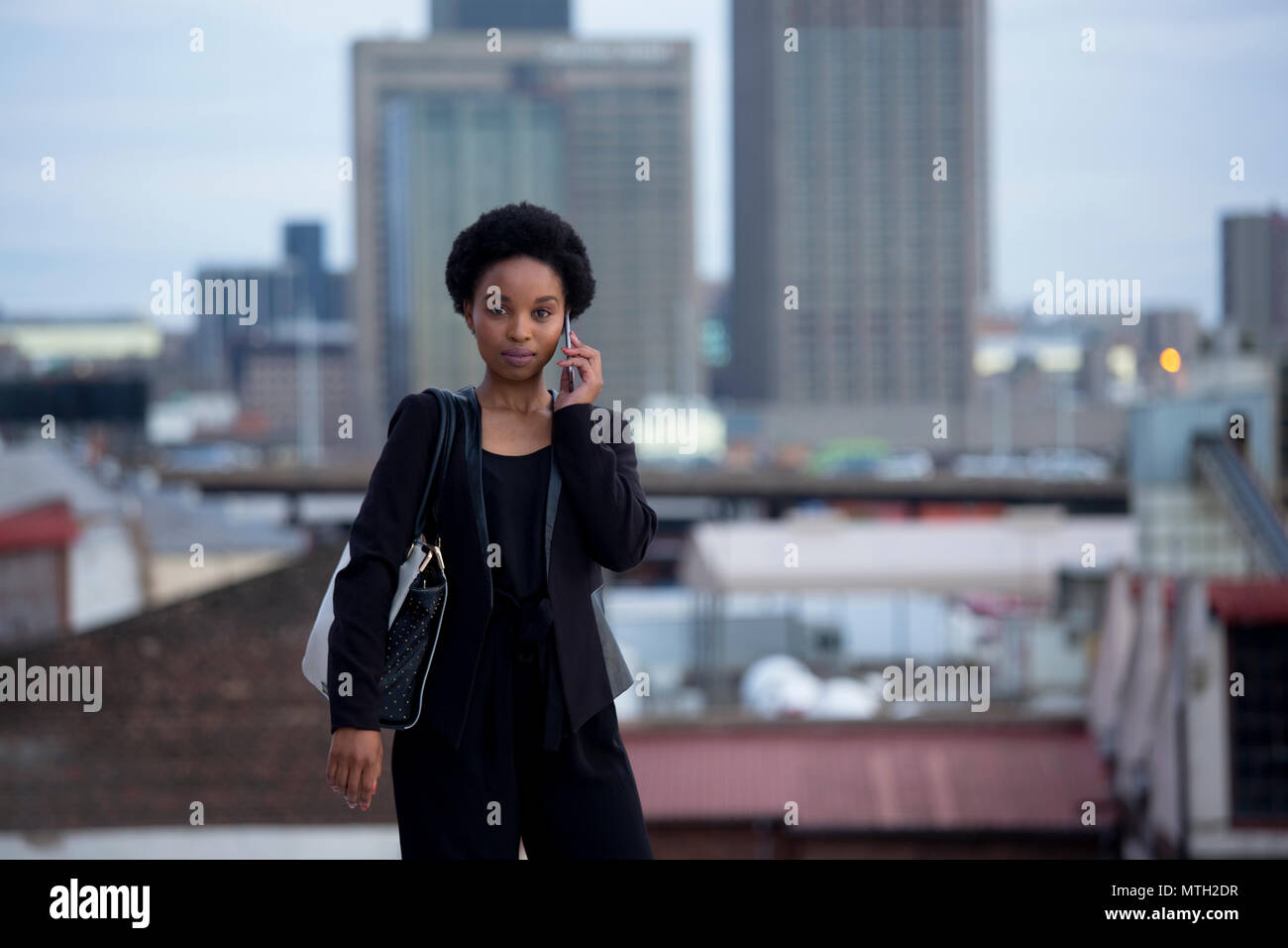 Business woman listening to a phone call Stock Photo - Alamy