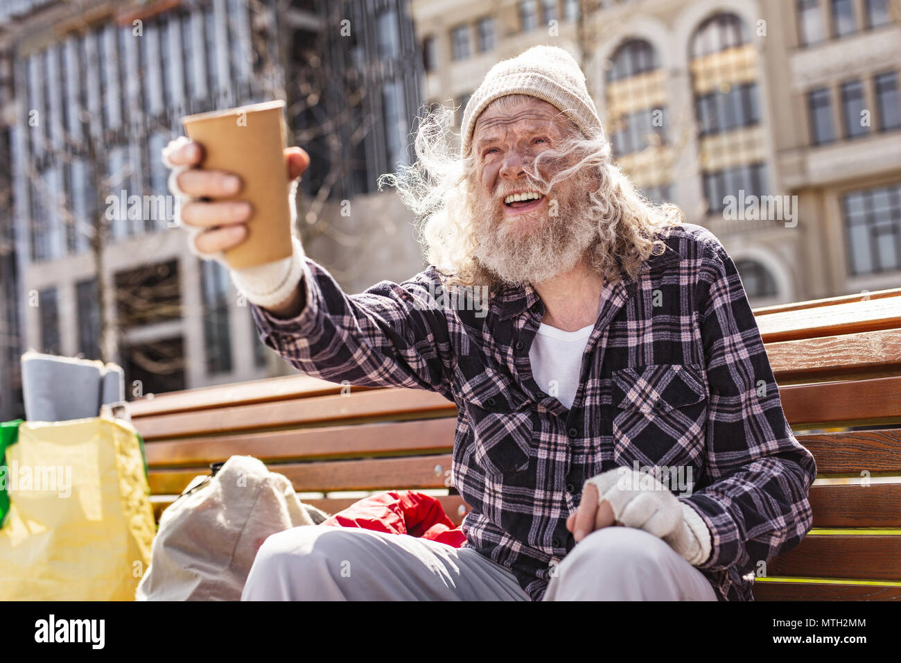 Positive poor man needing money Stock Photo - Alamy