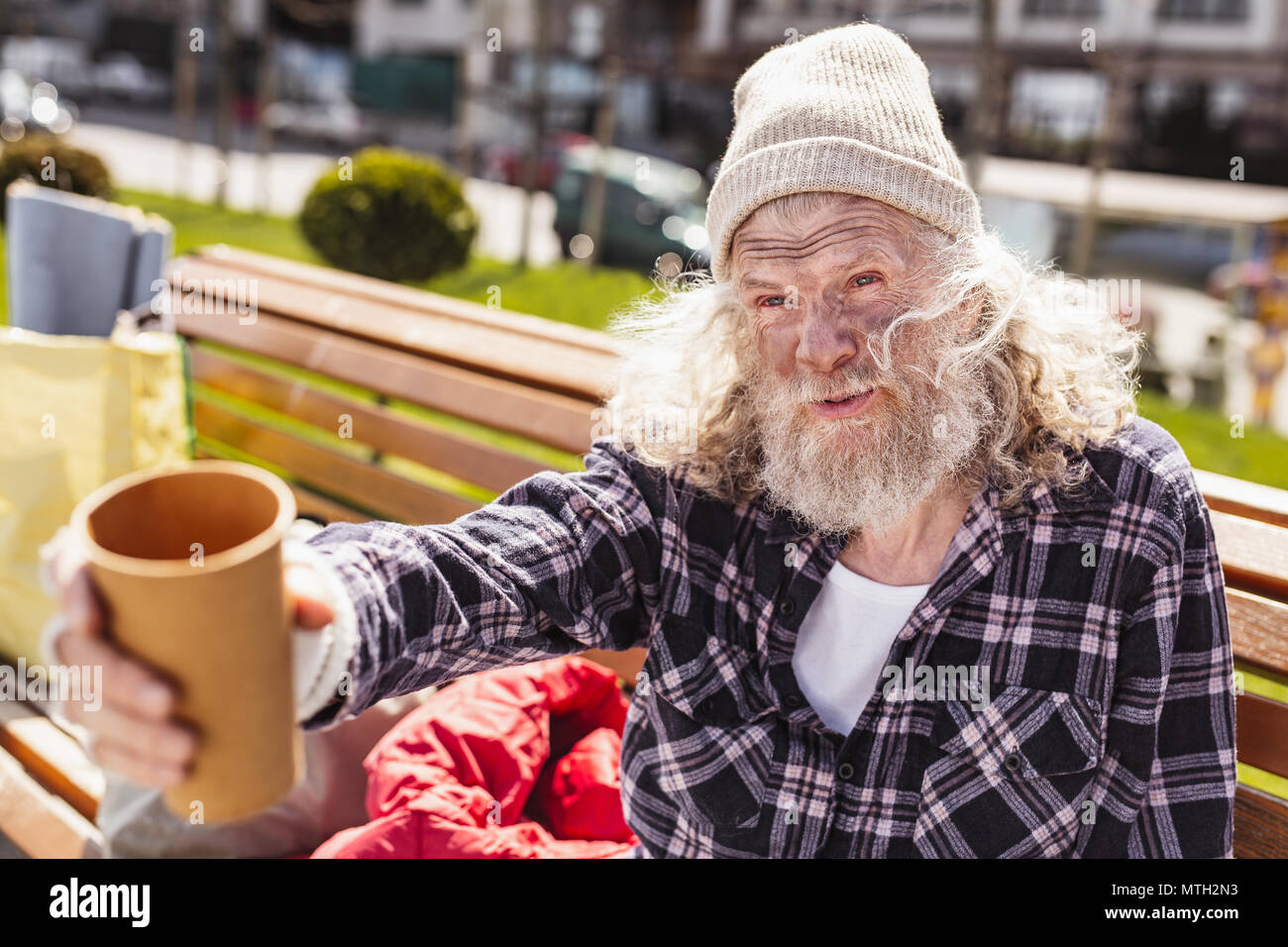 Poor bearded man being in the need for money Stock Photo - Alamy