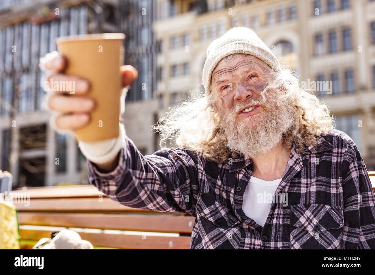 Cheerless poor man looking in front of him Stock Photo - Alamy