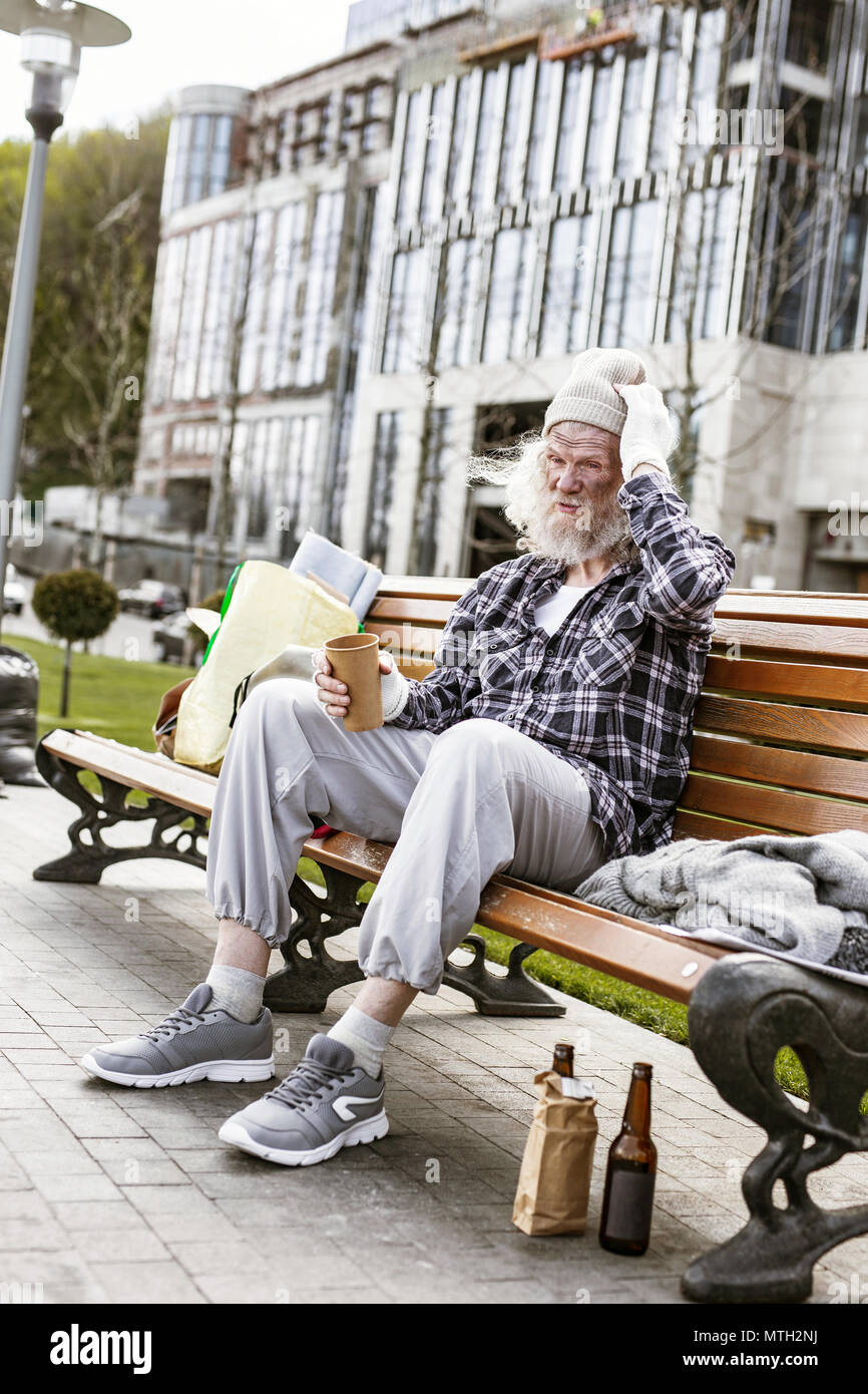 Sad depressed man sitting on the bench Stock Photo - Alamy