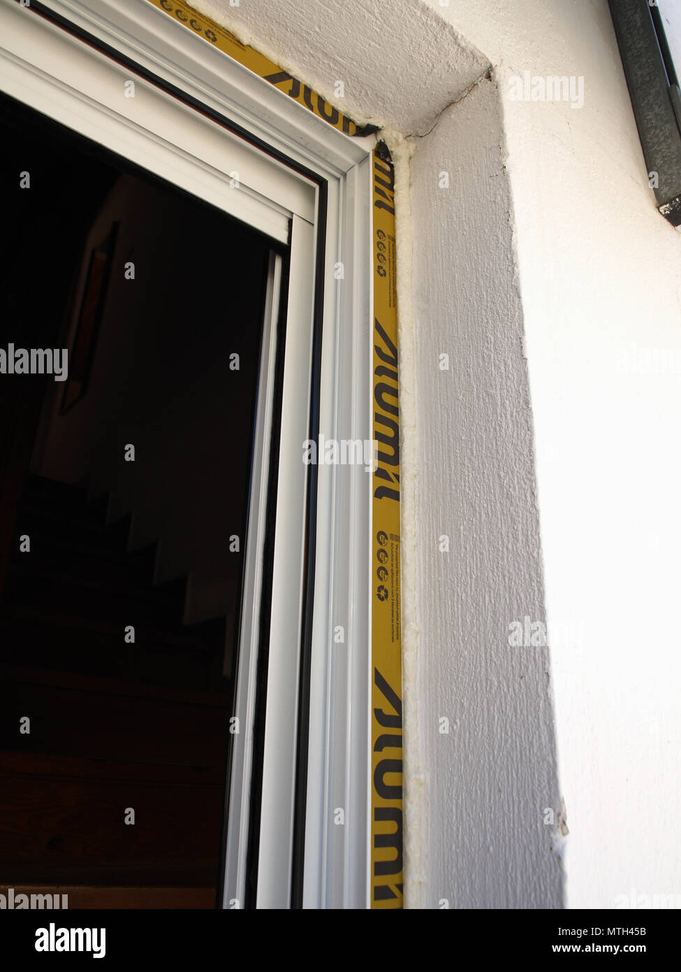 Alumil double glazed window frames and shutters being installed in ...