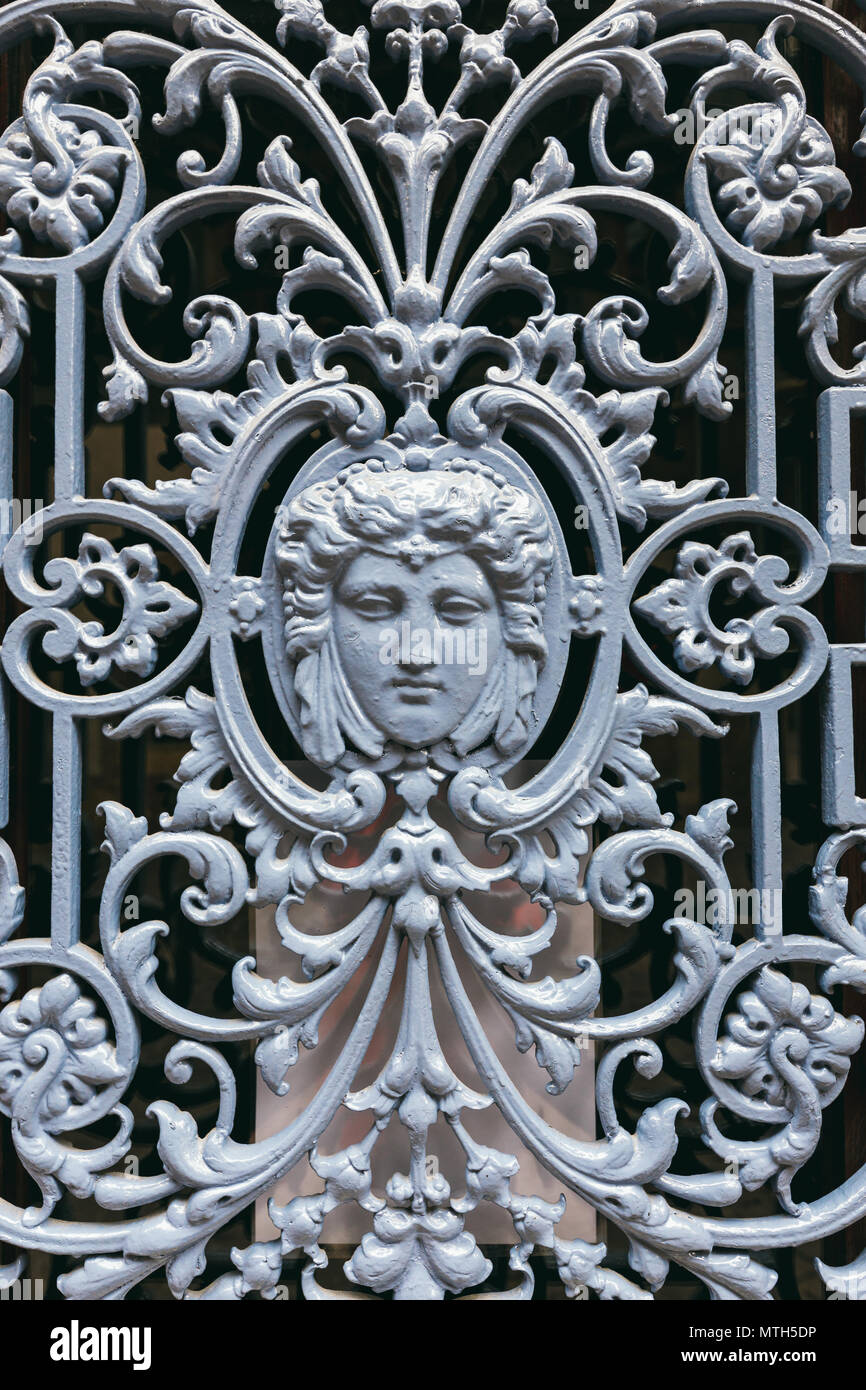 decorative forged lattice with the image of the face Stock Photo - Alamy
