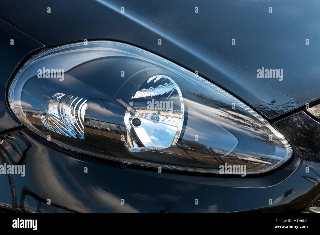 Close up of single modern vehicle headlamp design Stock Photo - Alamy