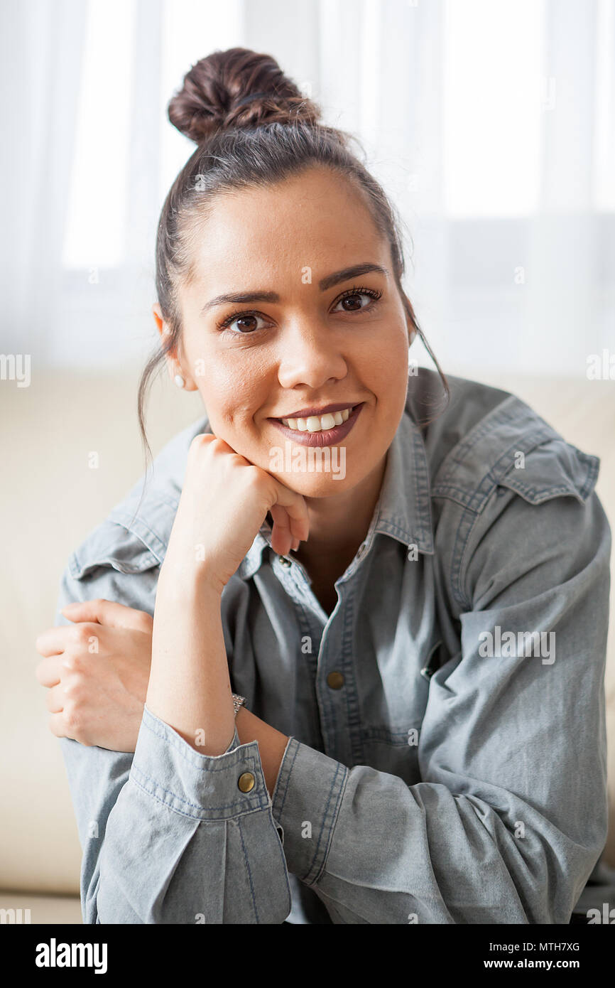 Portrait of beautiful woman on the couch Stock Photo - Alamy