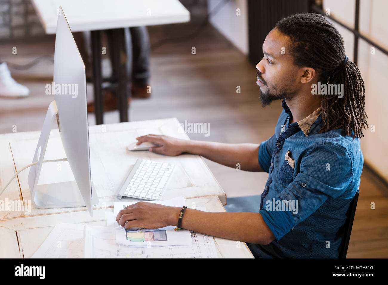 Young architect working on computer in office Stock Photo - Alamy