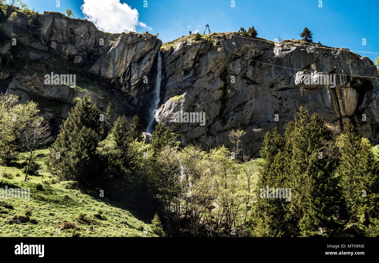 little waterfall on steep cliff sunny Stock Photo - Alamy