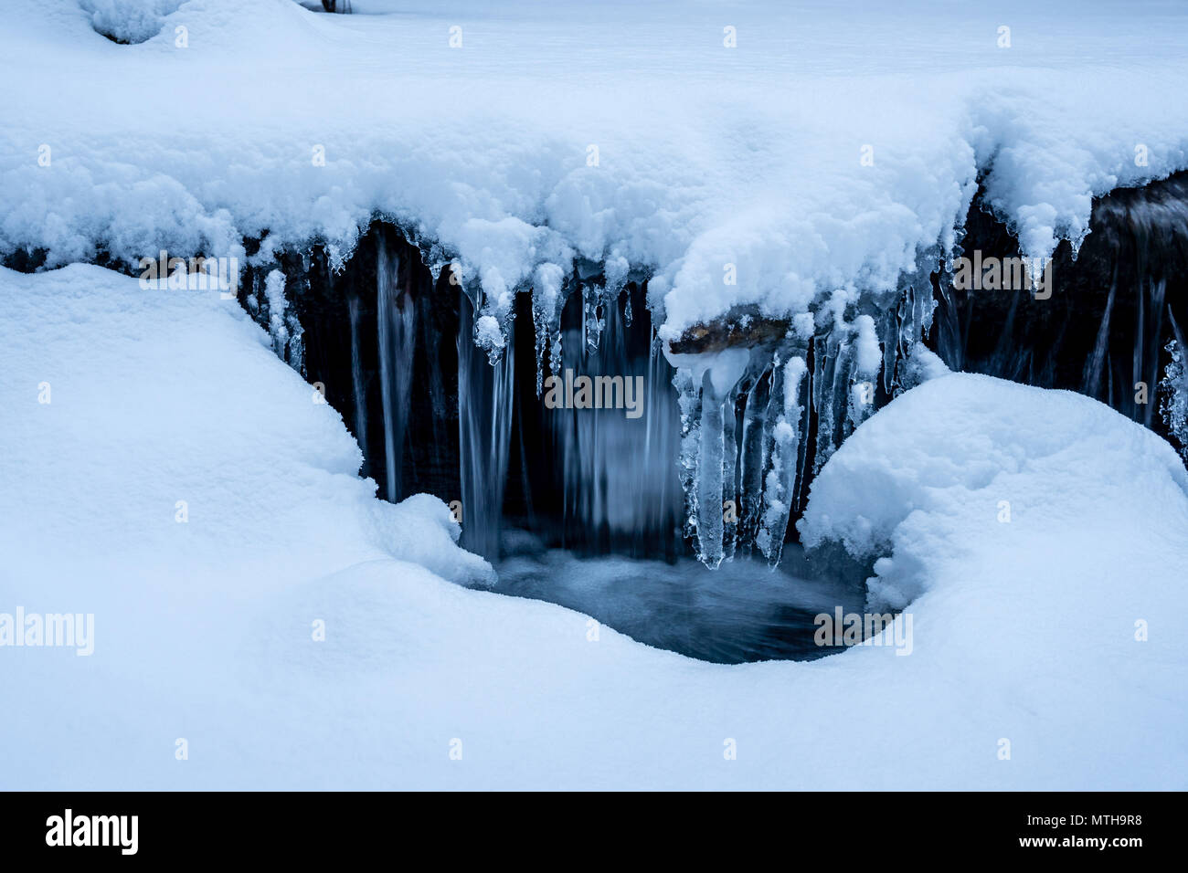 snowy stream frozen water closeup waterfall Stock Photo - Alamy