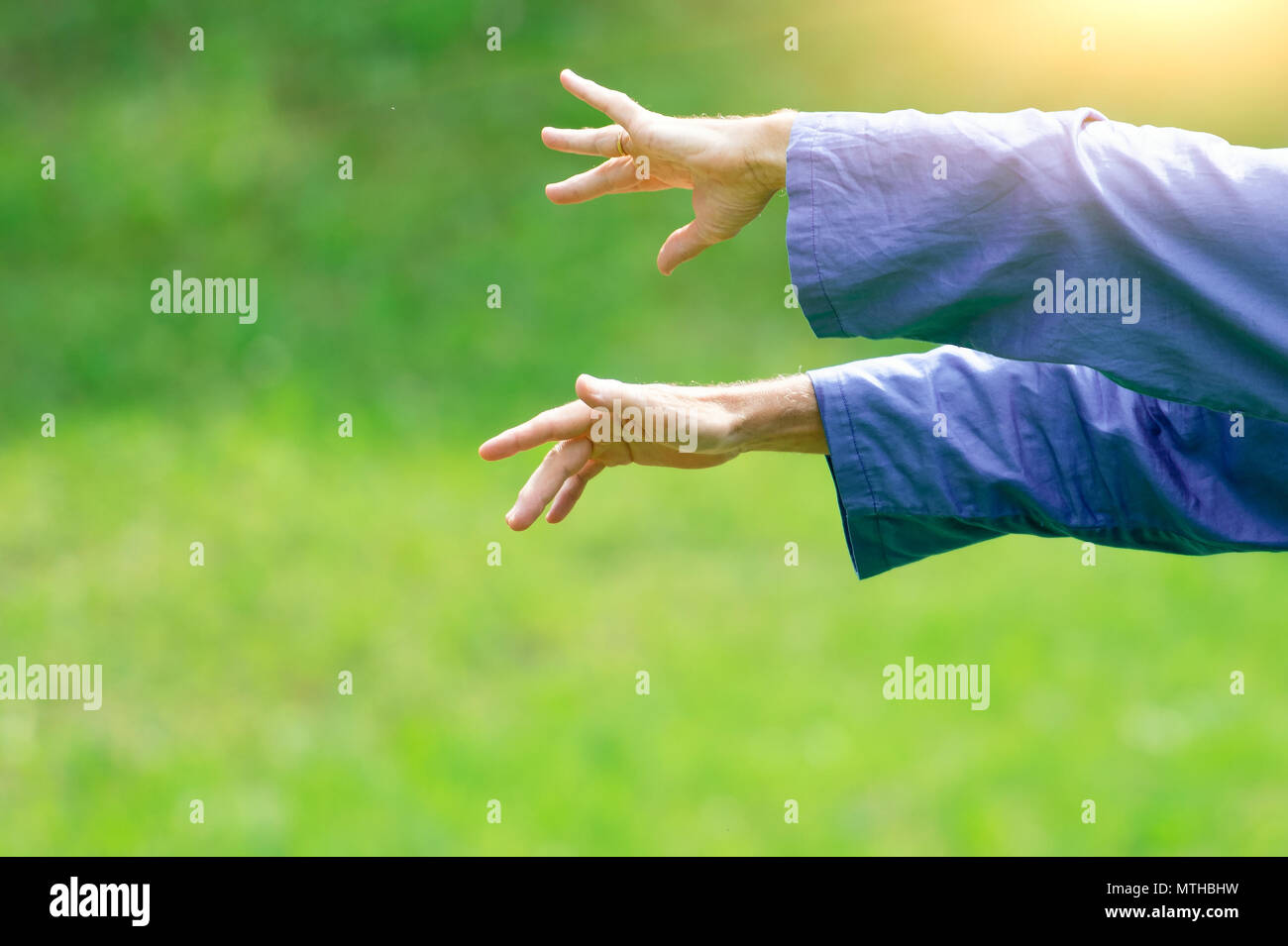 Detail of hand positions of a practicing of Tai Chi Chuan in outdoor ...
