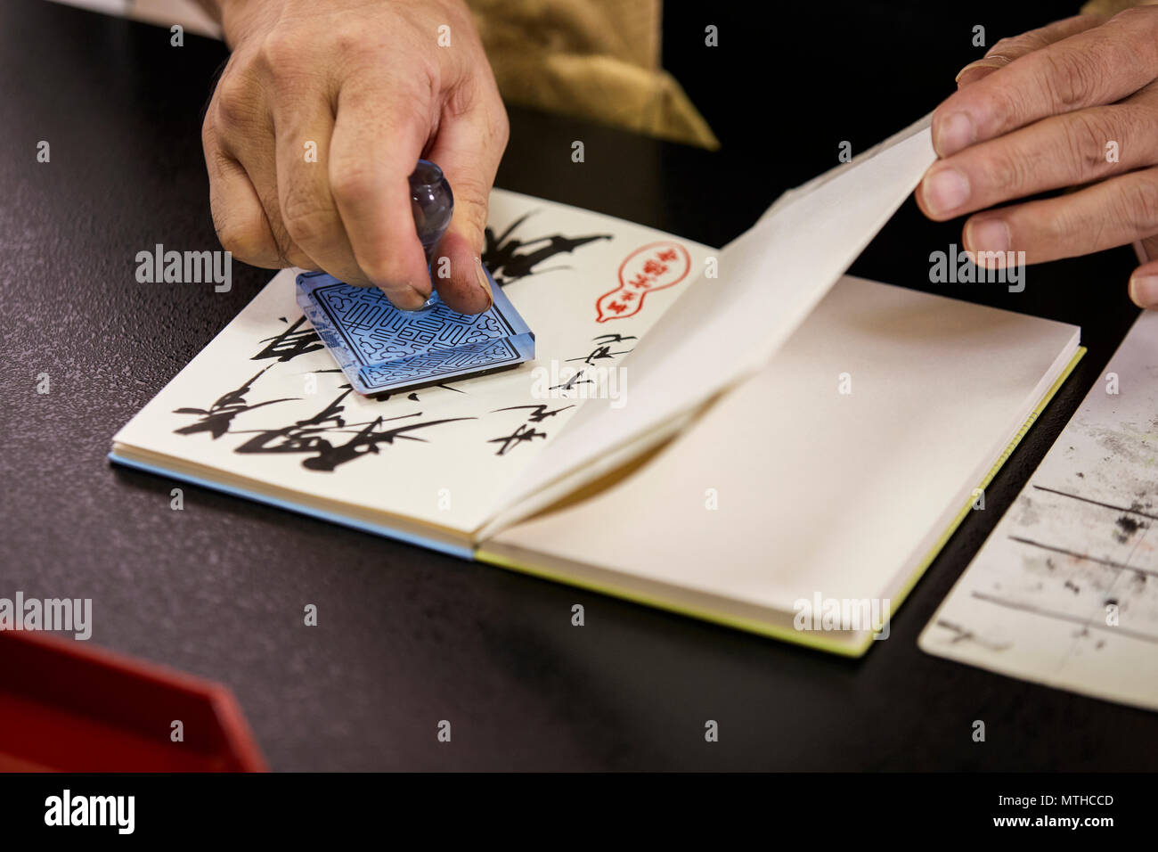 Japanese priest writing calligraphy Stock Photo - Alamy