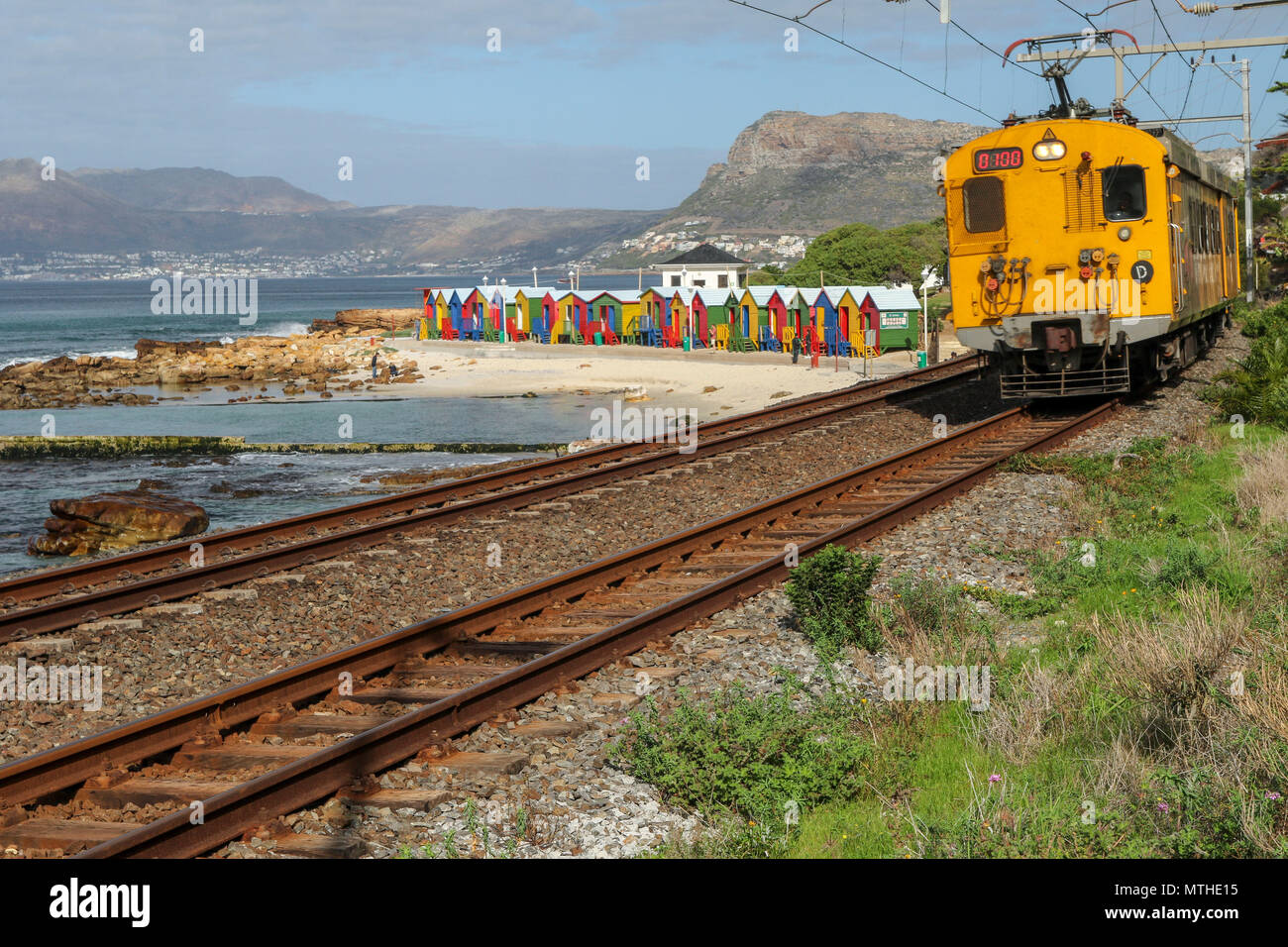 Yellow locomotive heading into simonstown station from simonstown ...