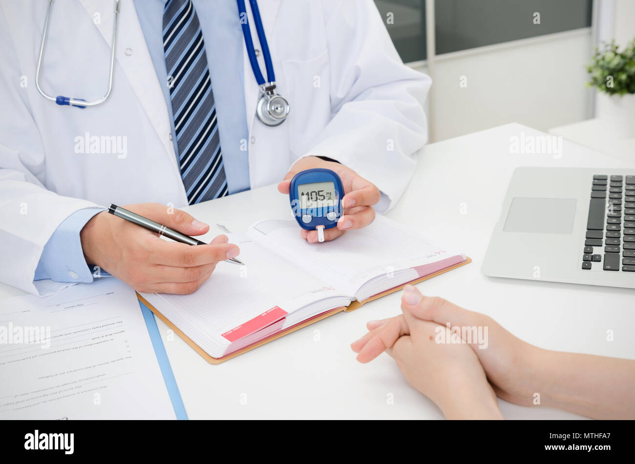 Doctor shows glucometer with glucose level. Doctor and patient diabetes ...