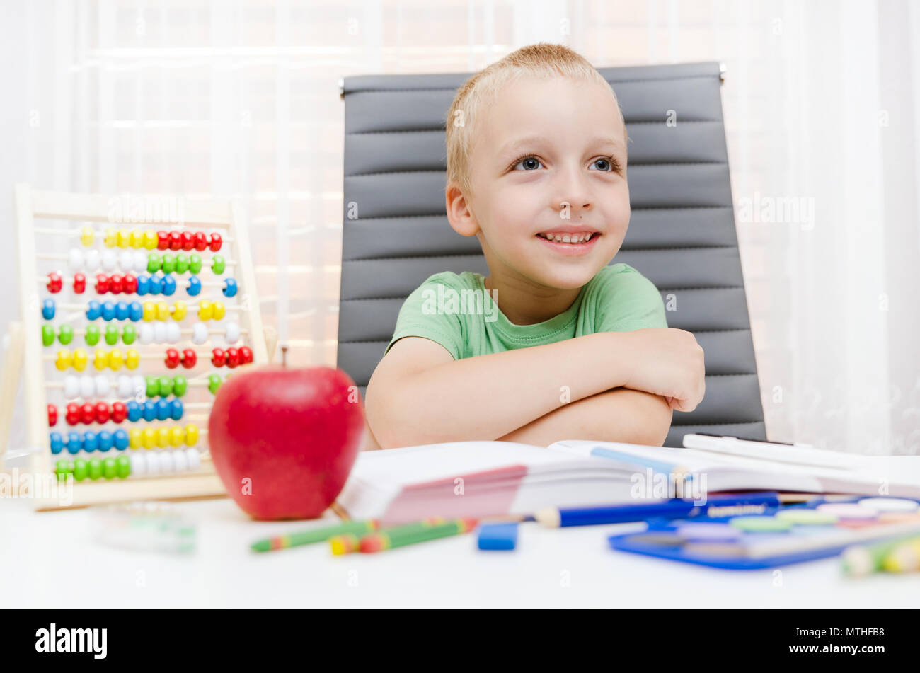 Preschooler, student doing homework at the desk. School child, little ...