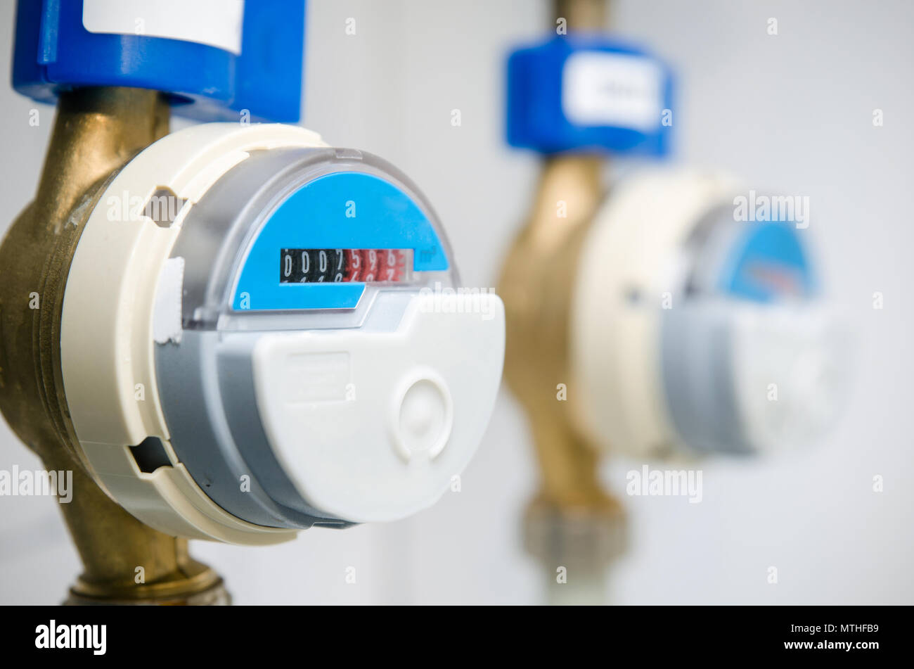 Blue modern radio wireless water counter meter close up Stock Photo - Alamy