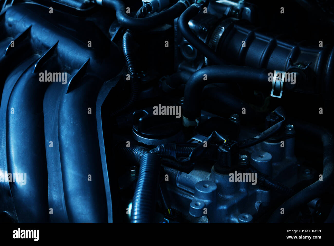 Close-up picture of car powerful engine with pipelines Stock Photo - Alamy