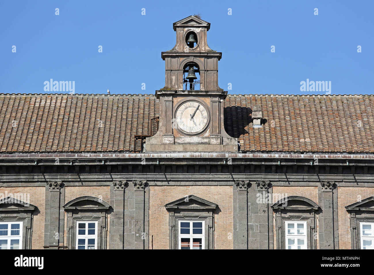 Clock and Bells at Building in Naples Stock Photo - Alamy