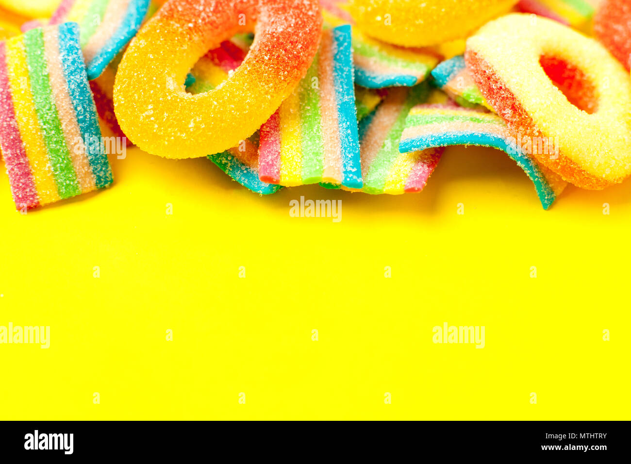 candies with jelly and sugar. colorful array of different childs sweets ...