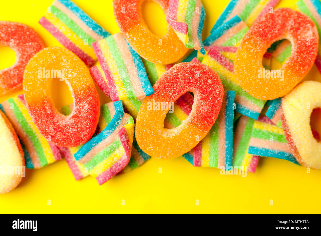 candies with jelly and sugar. colorful array of different childs sweets ...