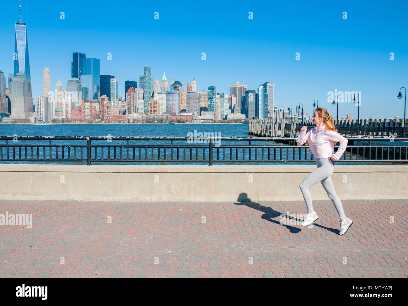 Healthy lifestyle. Woman is running in New York. Fitness sports runner ...