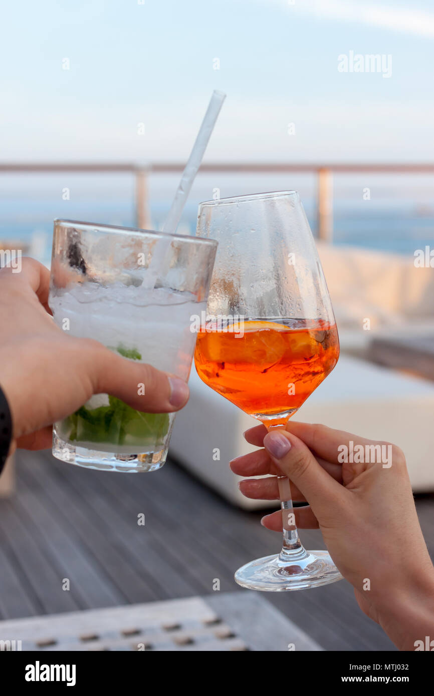 cheers two glasses with cocktails Stock Photo - Alamy