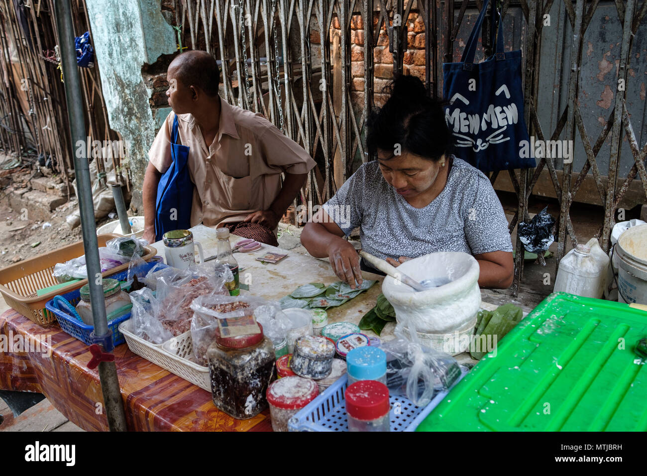 Betal Nut being prepaired for a customer by a street vendor in the 4th ...