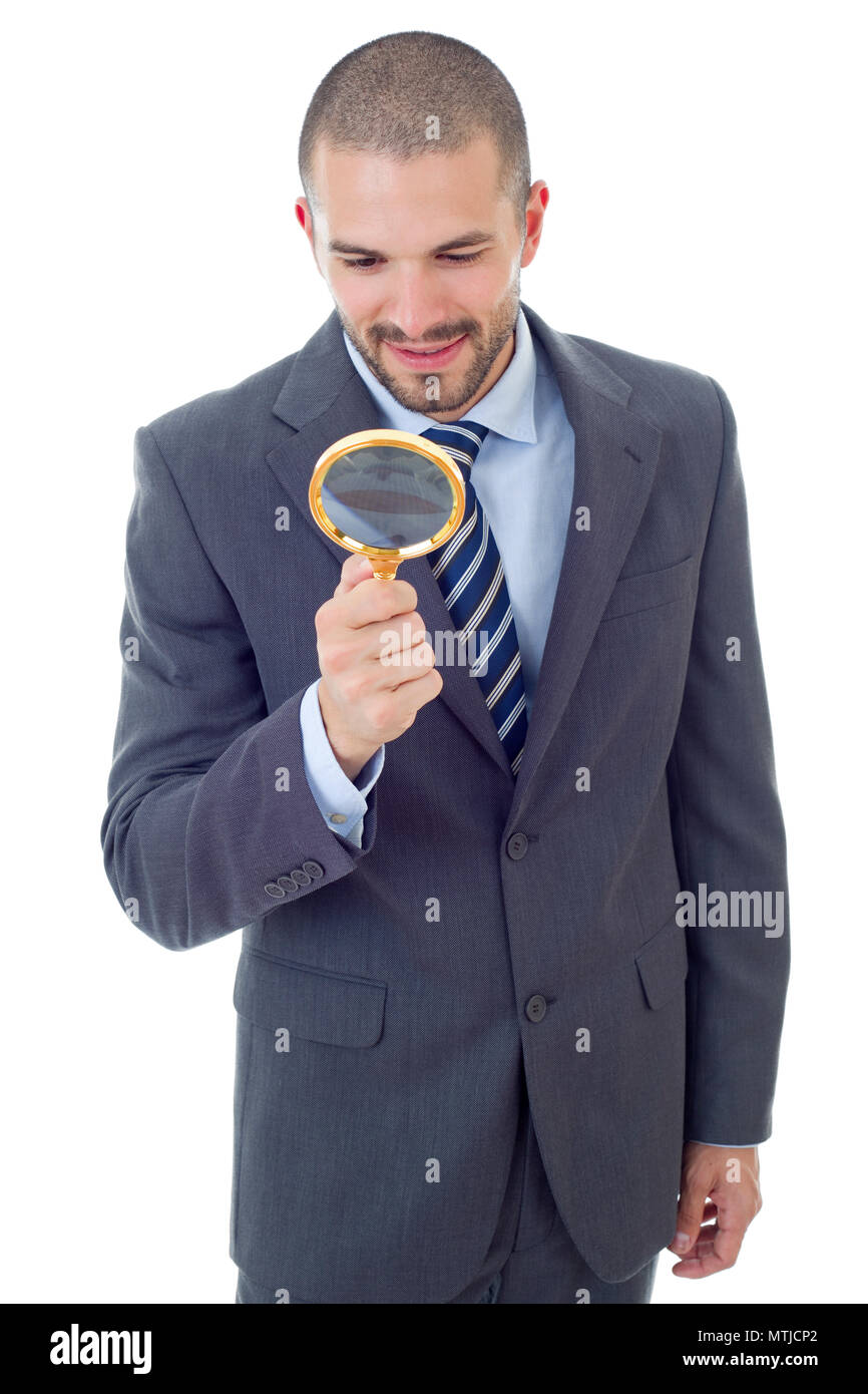 Isolated young business man with magnifying glass Stock Photo - Alamy