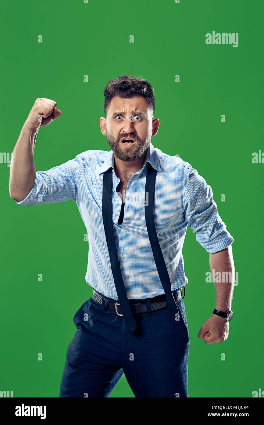 Screaming, hate, rage. Crying emotional angry man screaming on green ...