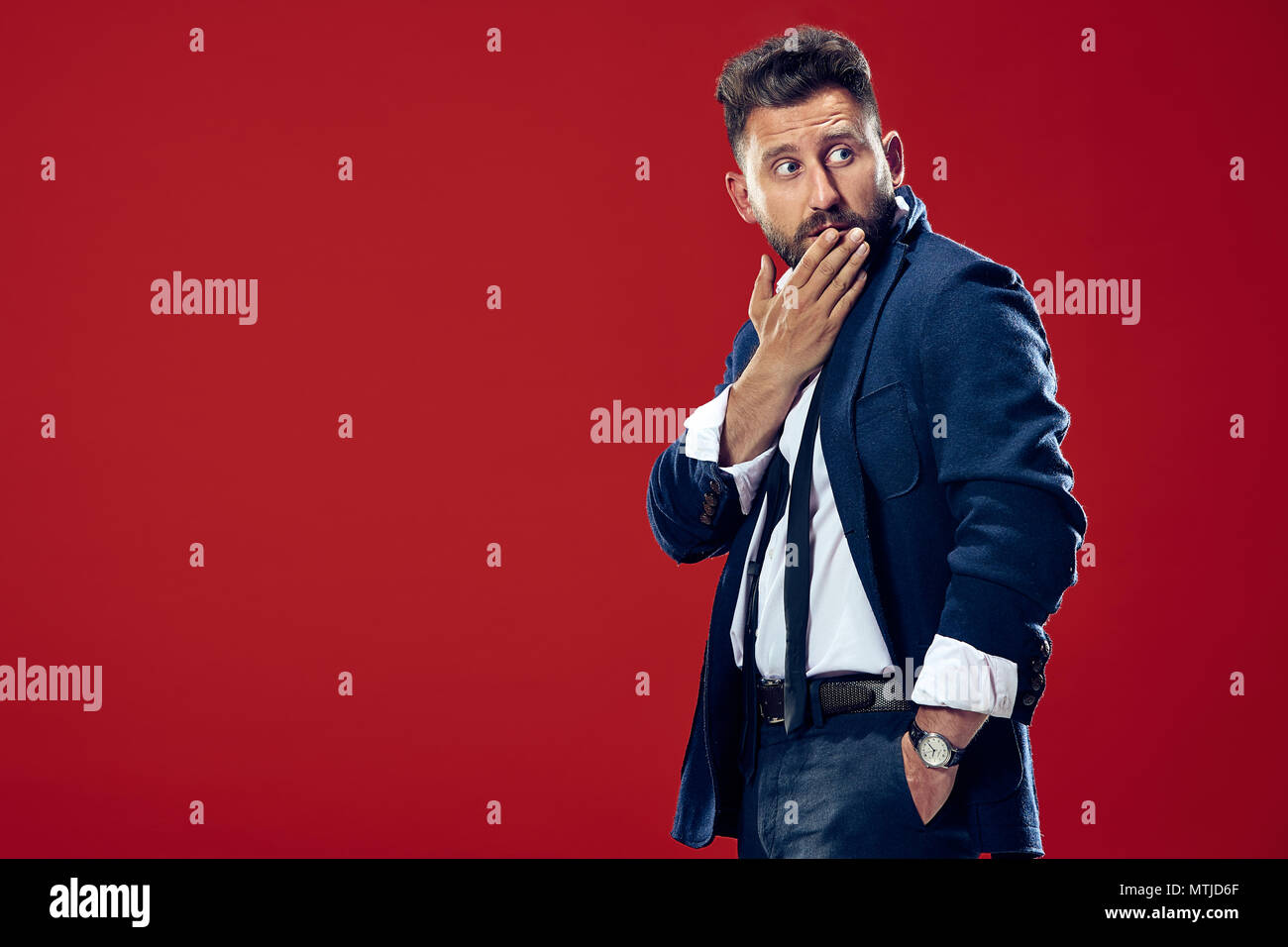 Secret, gossip concept. Young man whispering a secret behind his hand ...