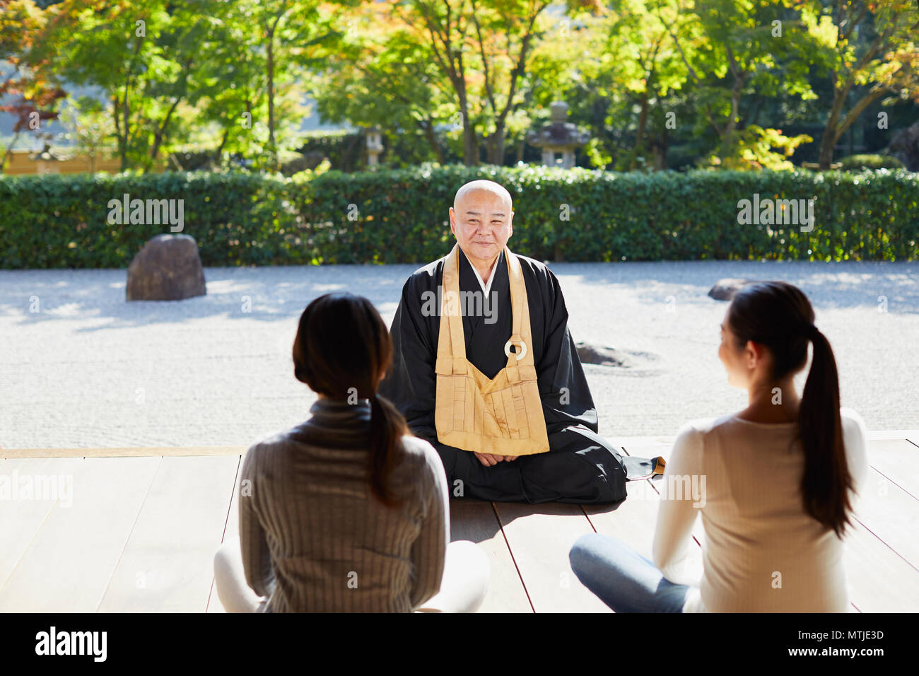 Japanese priest preaching to women at a temple Stock Photo - Alamy