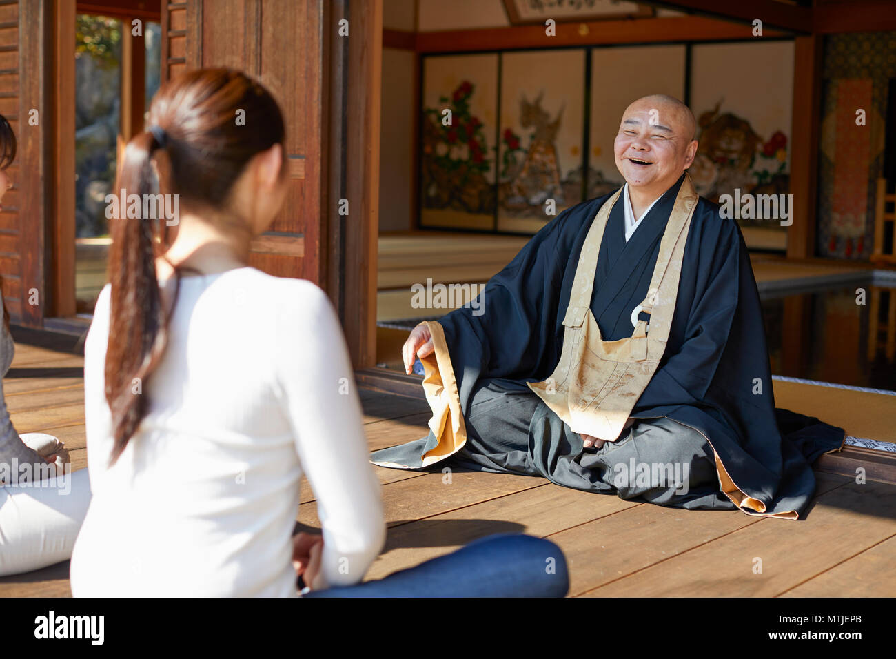 Japanese priest preaching to women at a temple Stock Photo - Alamy