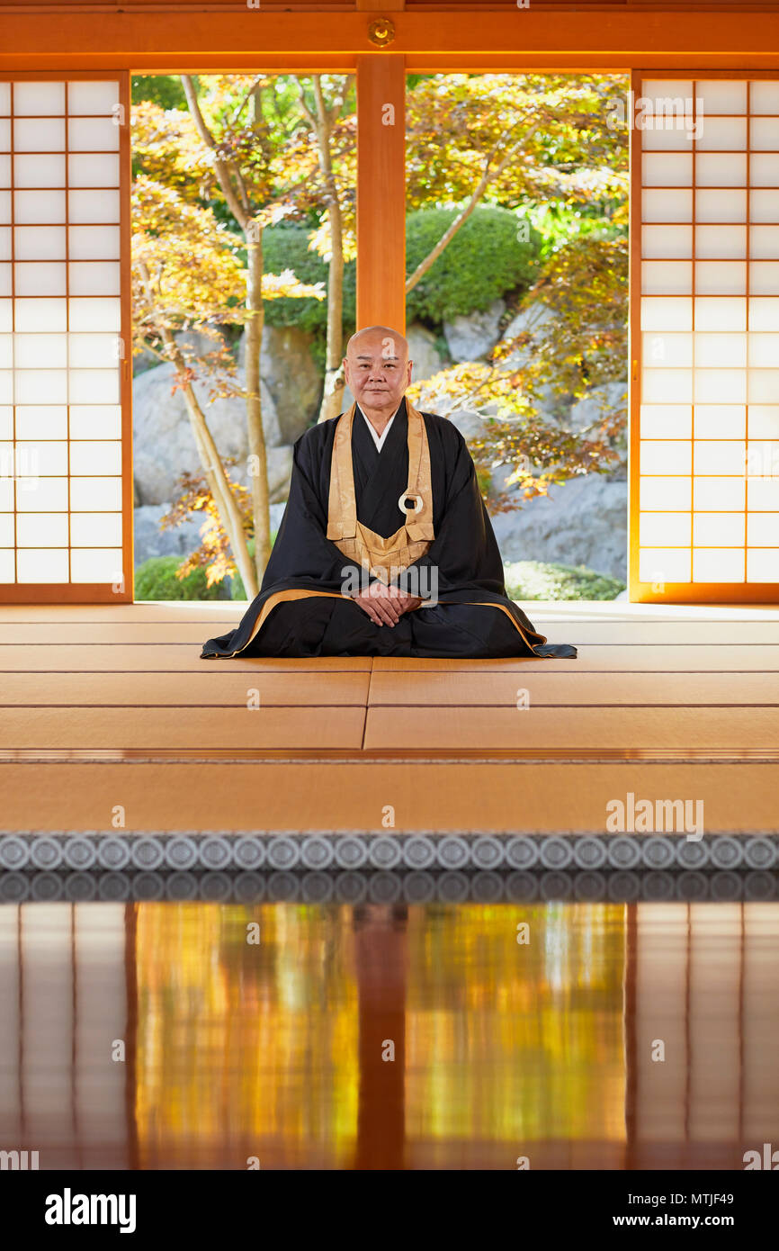 Japanese priest at a temple Stock Photo - Alamy