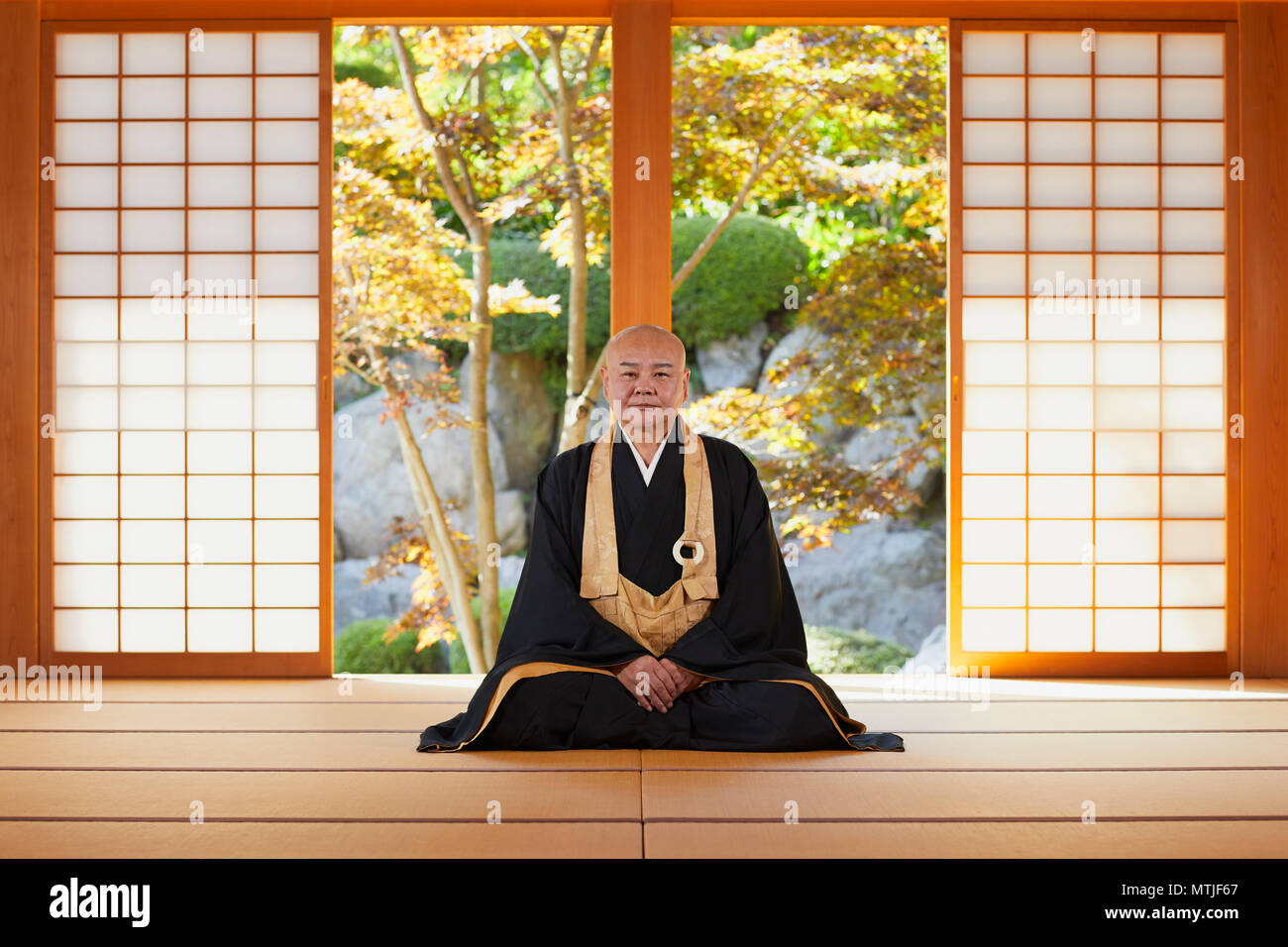 Japanese priest at a temple Stock Photo - Alamy