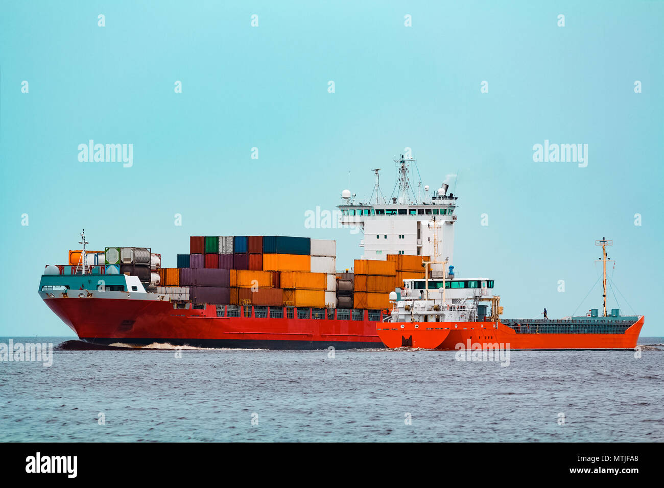 Red container ship. Logistics and production export Stock Photo - Alamy