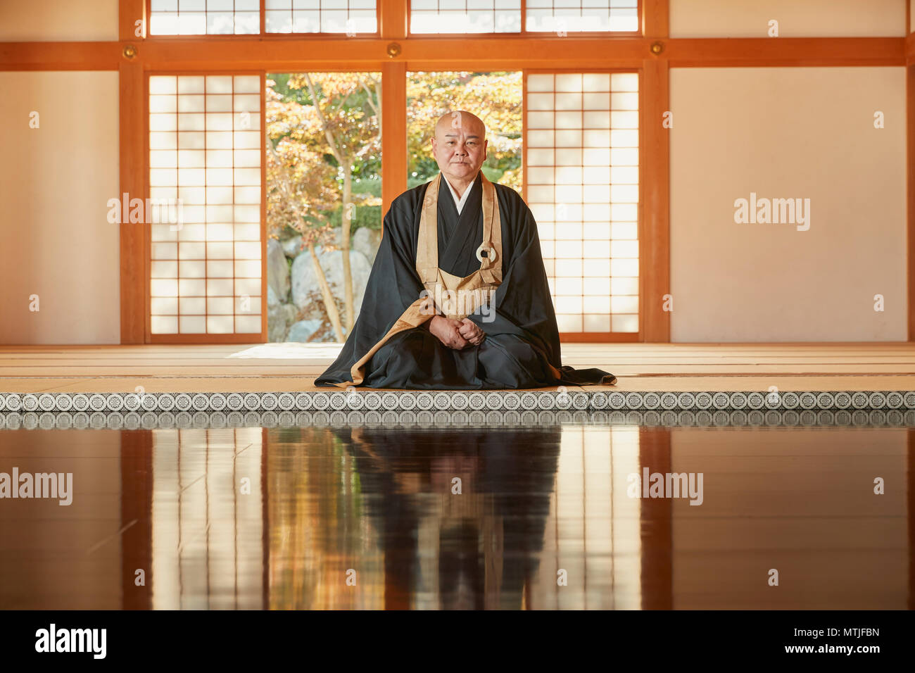 Japanese priest at a temple Stock Photo - Alamy