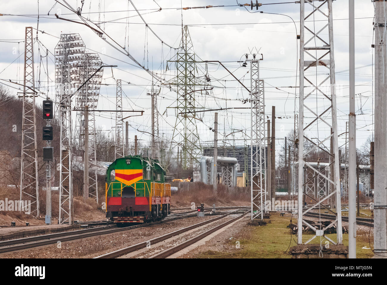 Green diesel cargo locomotive. Freight train in action Stock Photo - Alamy