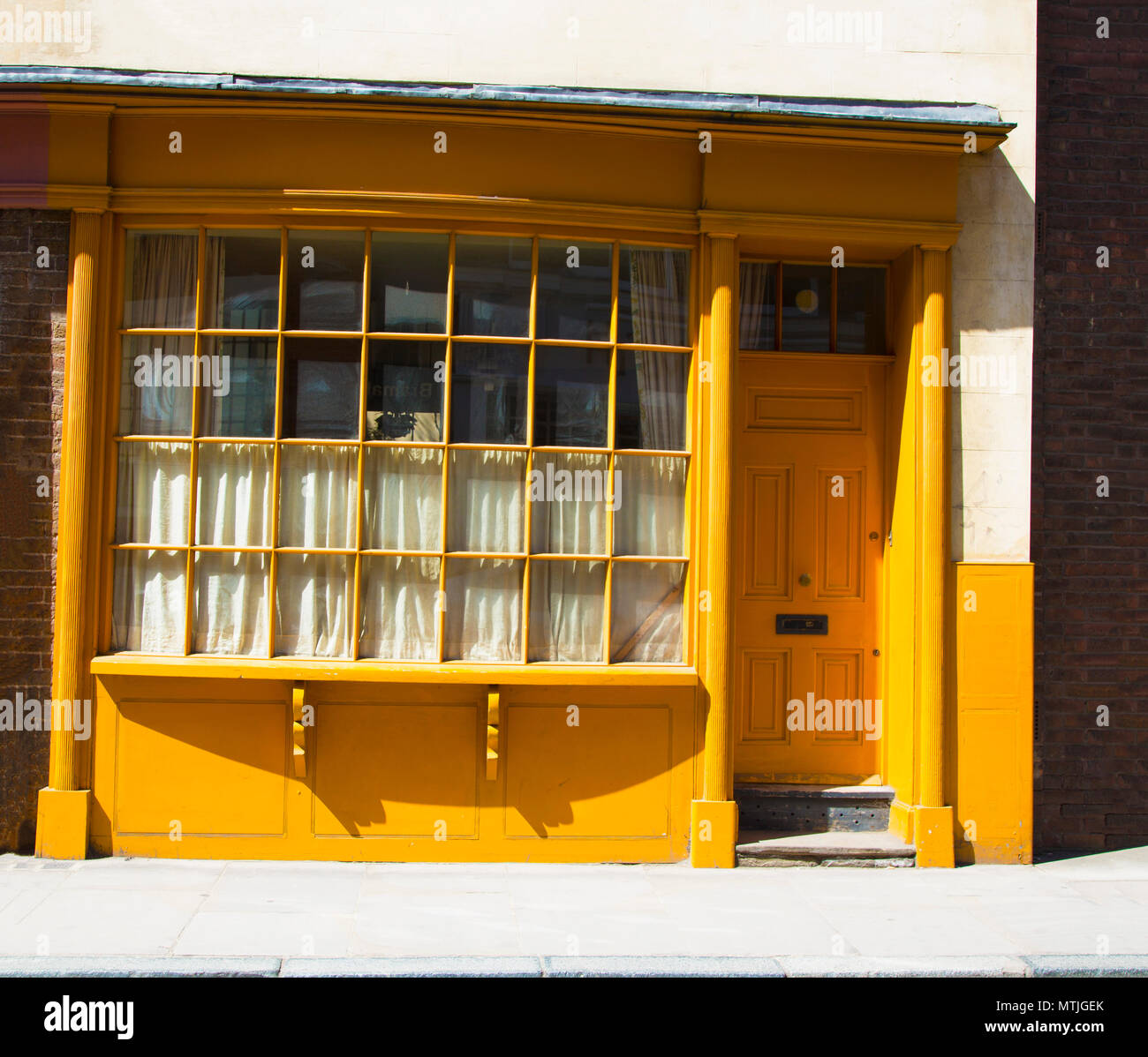 The front of a Victorian house painted in yellow in Bermondsey Street ...